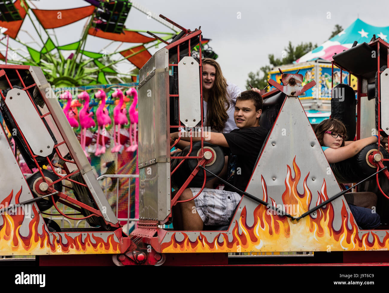 Popular ride with children at the county fair Stock Photo - Alamy