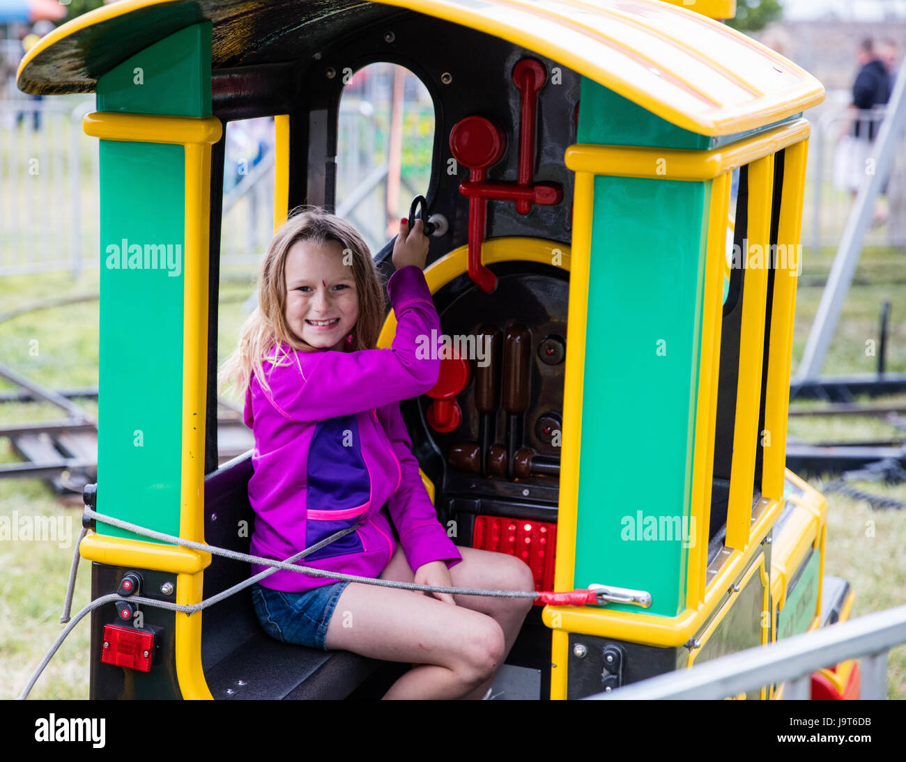 Children on a train ride at the county fair Stock Photo - Alamy