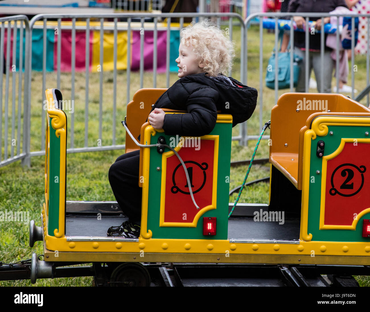Children on a train ride at the county fair Stock Photo - Alamy