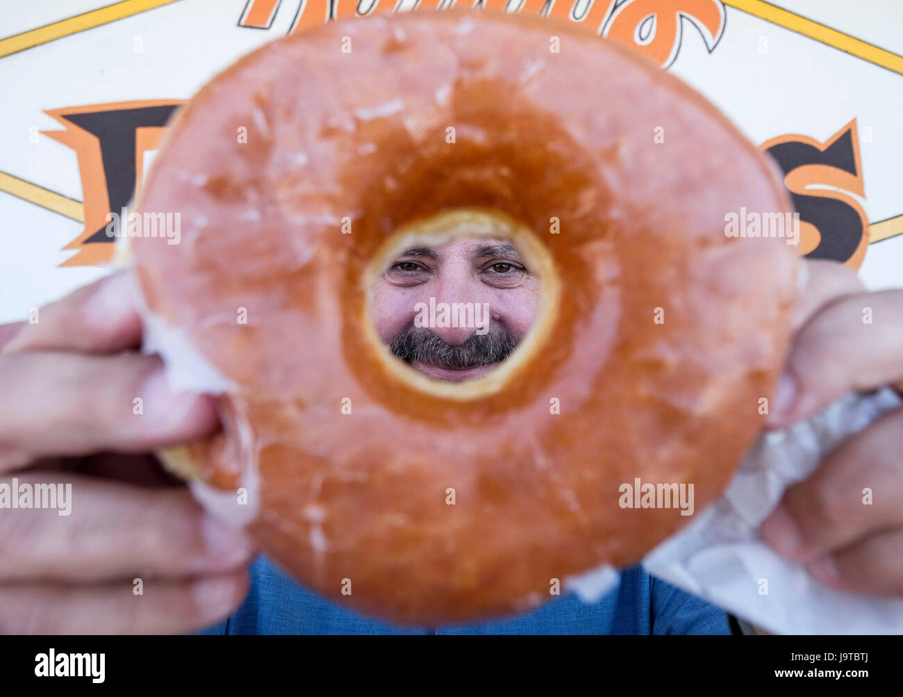 Los Angeles, USA. 2nd June, 2017. A shopkeeper displays a donut in ...