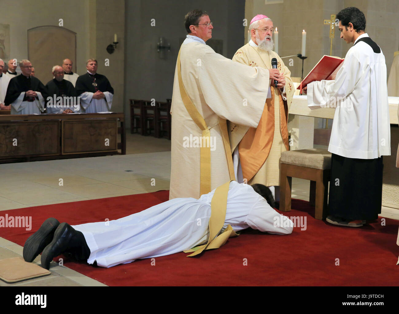 Catholic bishop ordains priest hi-res stock photography and images - Alamy