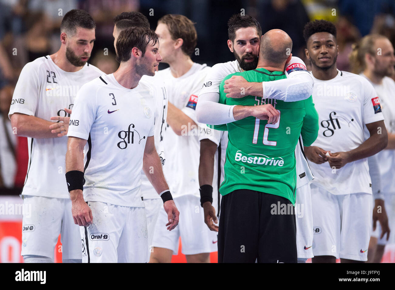 Nikola Karabatic (3-R) of Paris hugs goalkeeper Gorazd ·kof (2-R) after ...