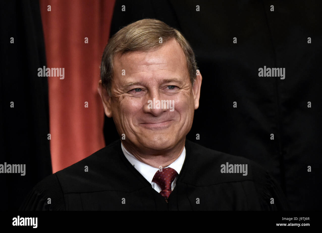 Chief Justice of the United States John G. Roberts poses during a group ...