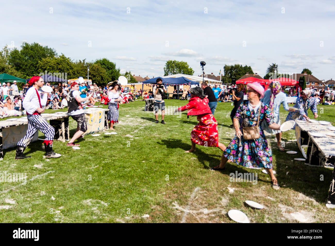 Two opposing teams throwing custard pies at each other during the World ...