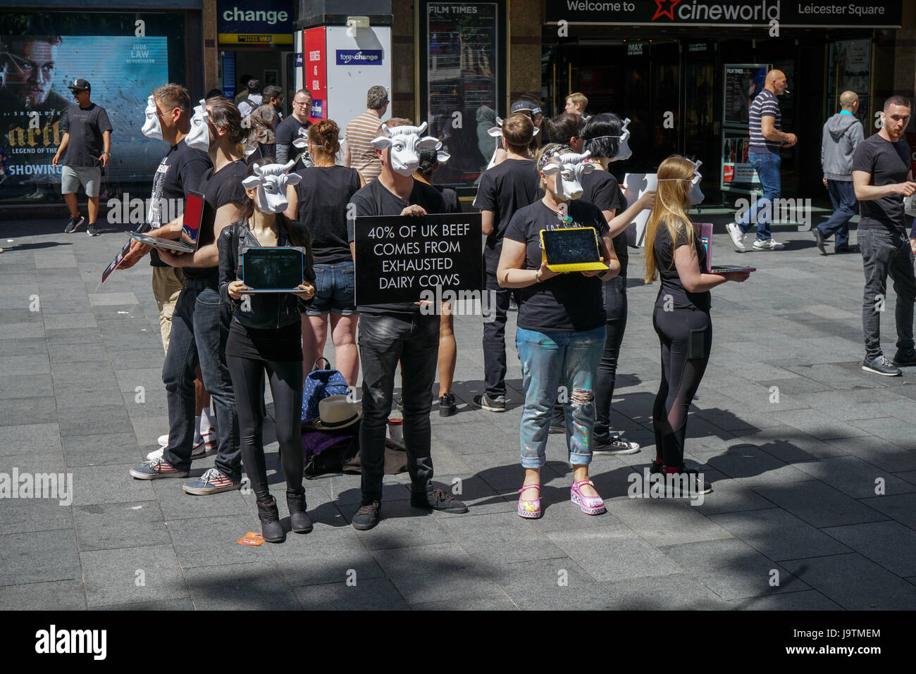 London, UK. 3rd June, 2017. Animal rights protesters wearing cow masks ...
