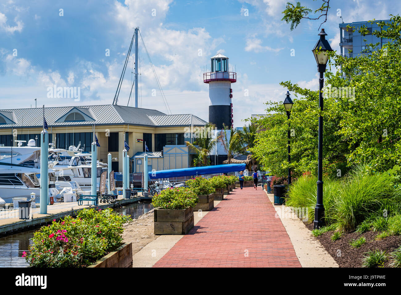 The Waterfront Promenade, a marina and lighthouse in Canton, Baltimore ...