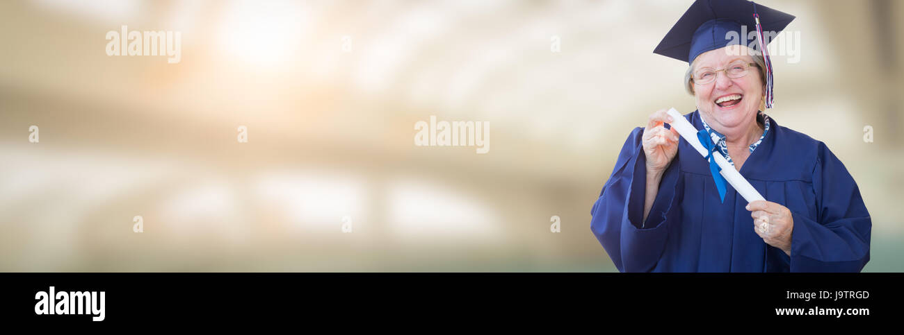 Banner of Happy Senior Adult Woman Graduate In Cap and Gown Holding ...