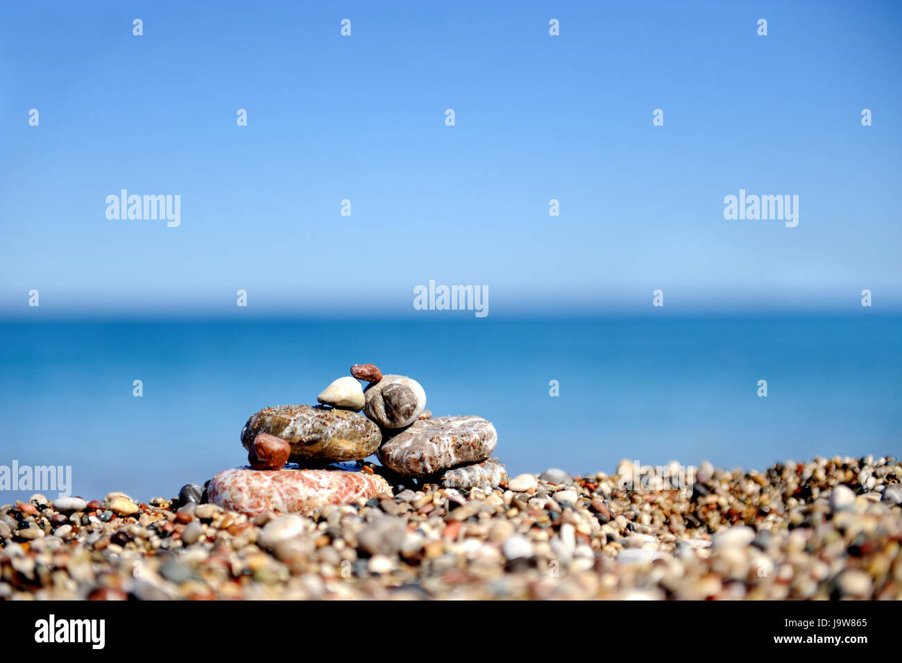 Stack of pebble stones at the beach Stock Photo - Alamy