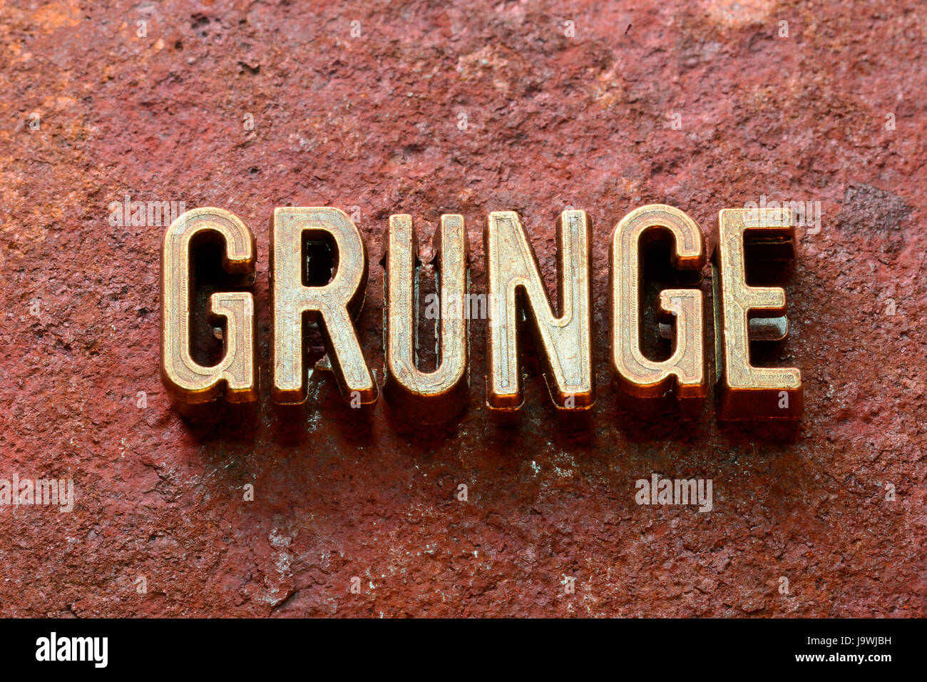 grunge word made from metallic letters on red rusty surface Stock Photo ...
