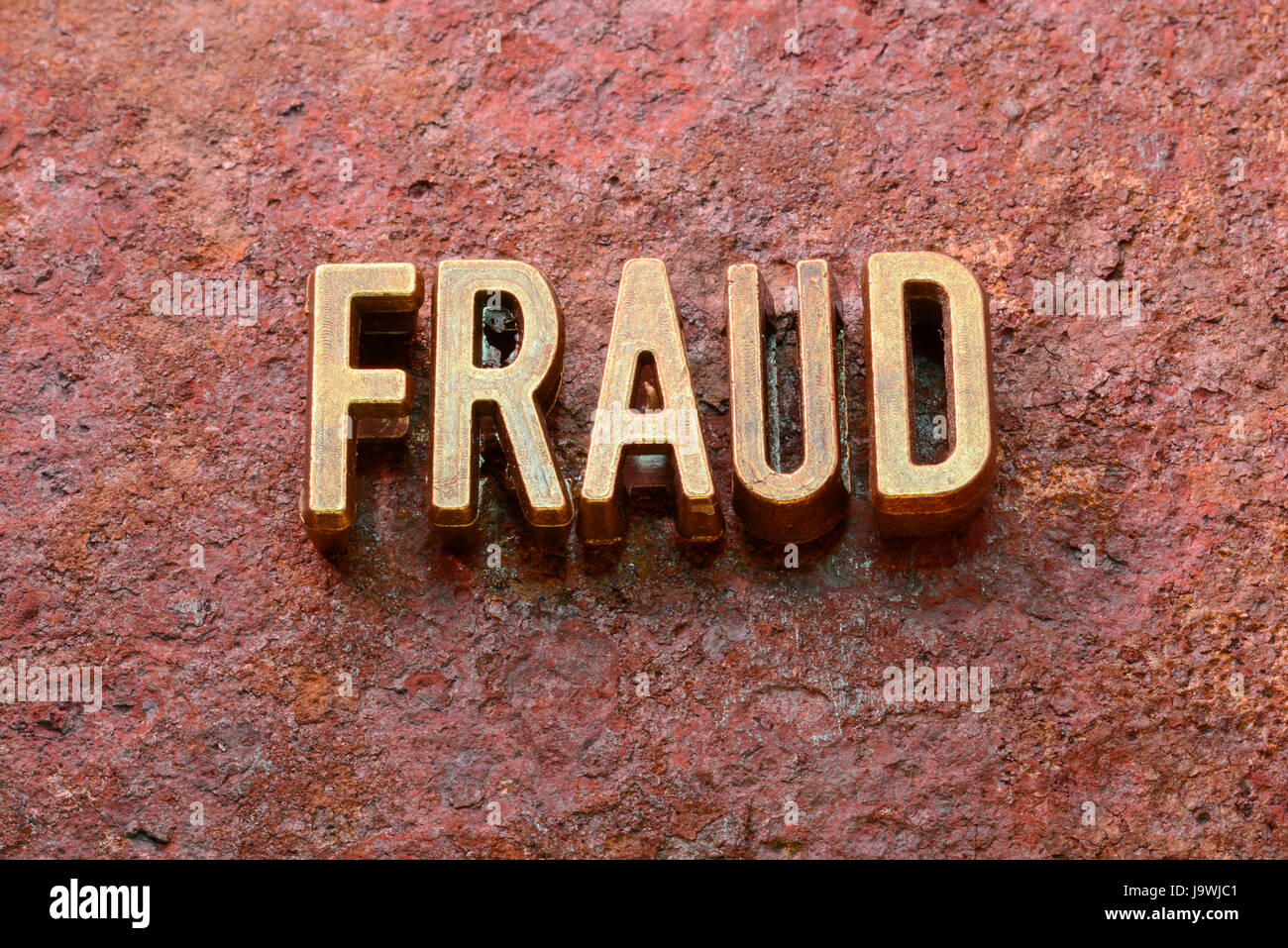 fraud word made from metallic letters on red rusty surface Stock Photo ...