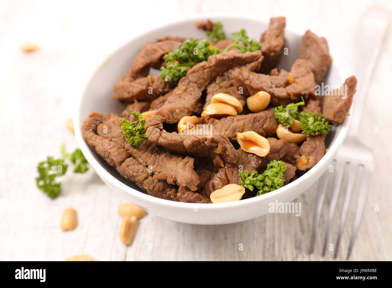 fried beef with almond Stock Photo - Alamy