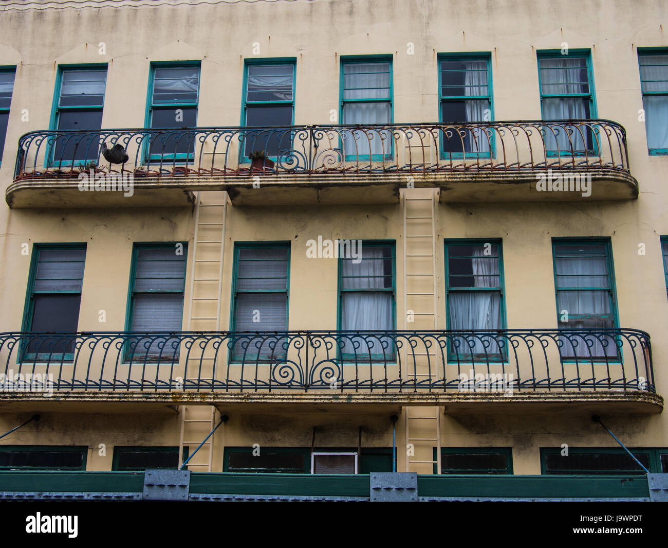 Twin Balconies On A Building With Rows Of Repeating Windows Stock Photo ...