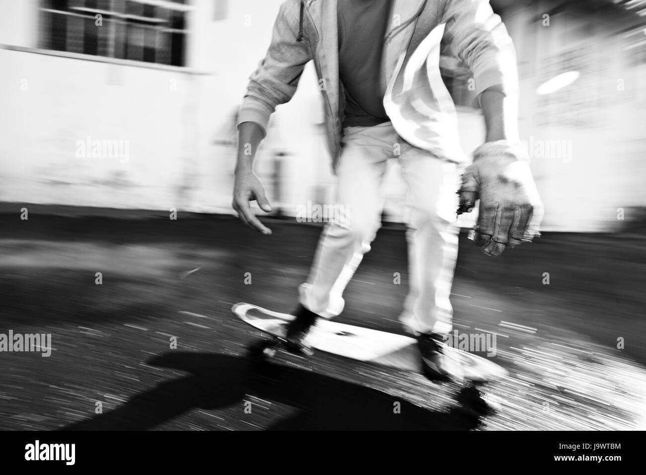 Skateboarder riding a longboard Stock Photo - Alamy