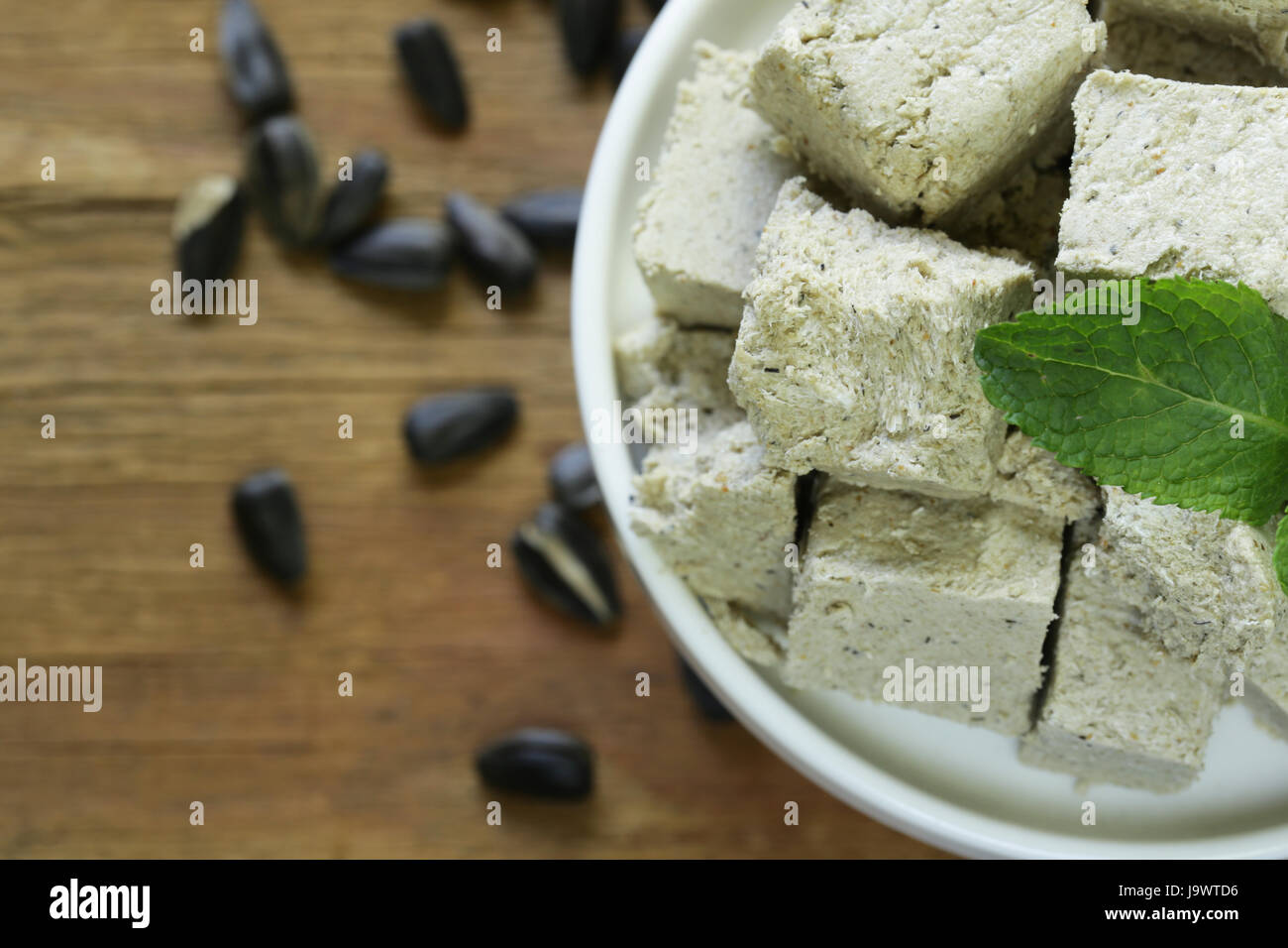 Oriental sweets halva from sunflower seeds with honey Stock Photo - Alamy