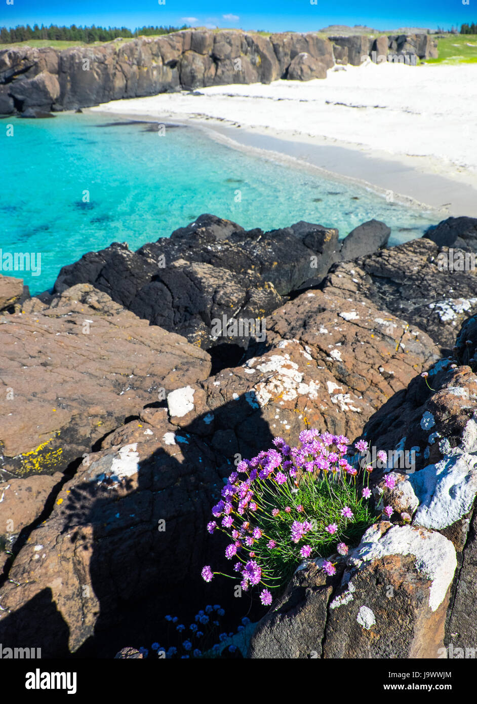 Crystal clear waters and white sand at Langamull beach on the north ...