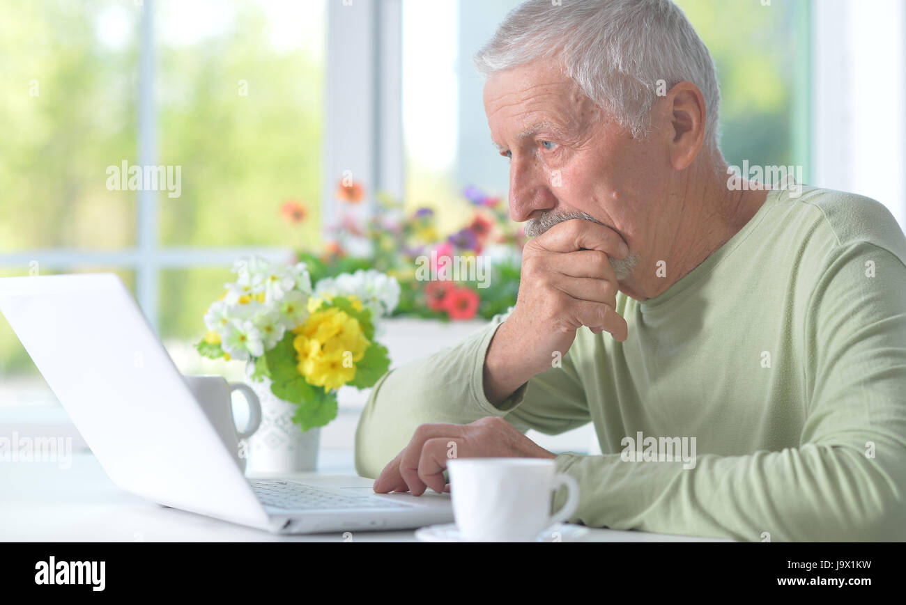 Beautiful old man with a laptop Stock Photo - Alamy