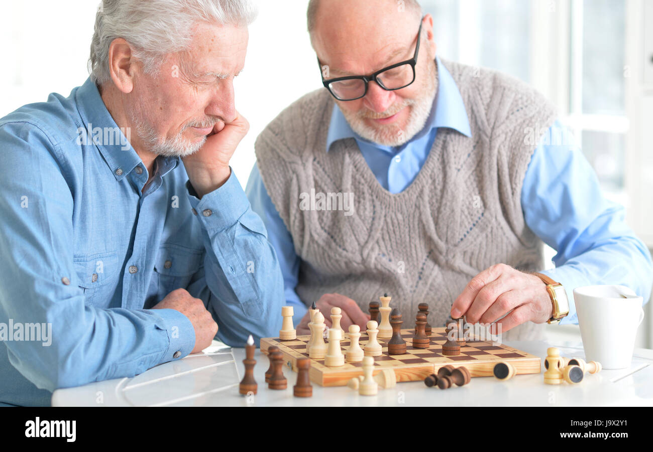 Beautiful old men play chess Stock Photo - Alamy