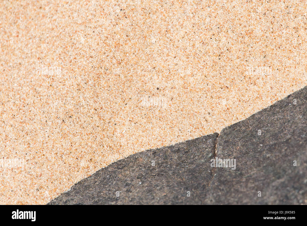 An abstract background of a sea sand and rock shapes. Shallow depth of ...