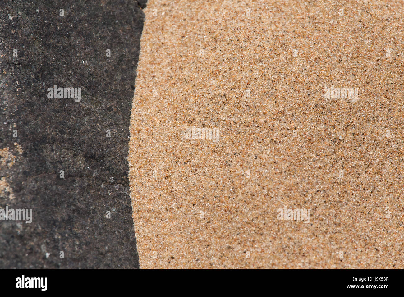 An abstract background of a sea sand and rock shapes. Shallow depth of ...