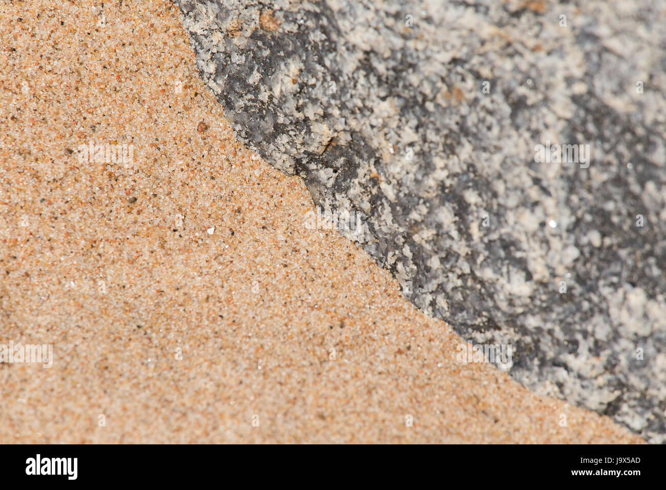 An abstract background of a sea sand and rock shapes. Shallow depth of ...