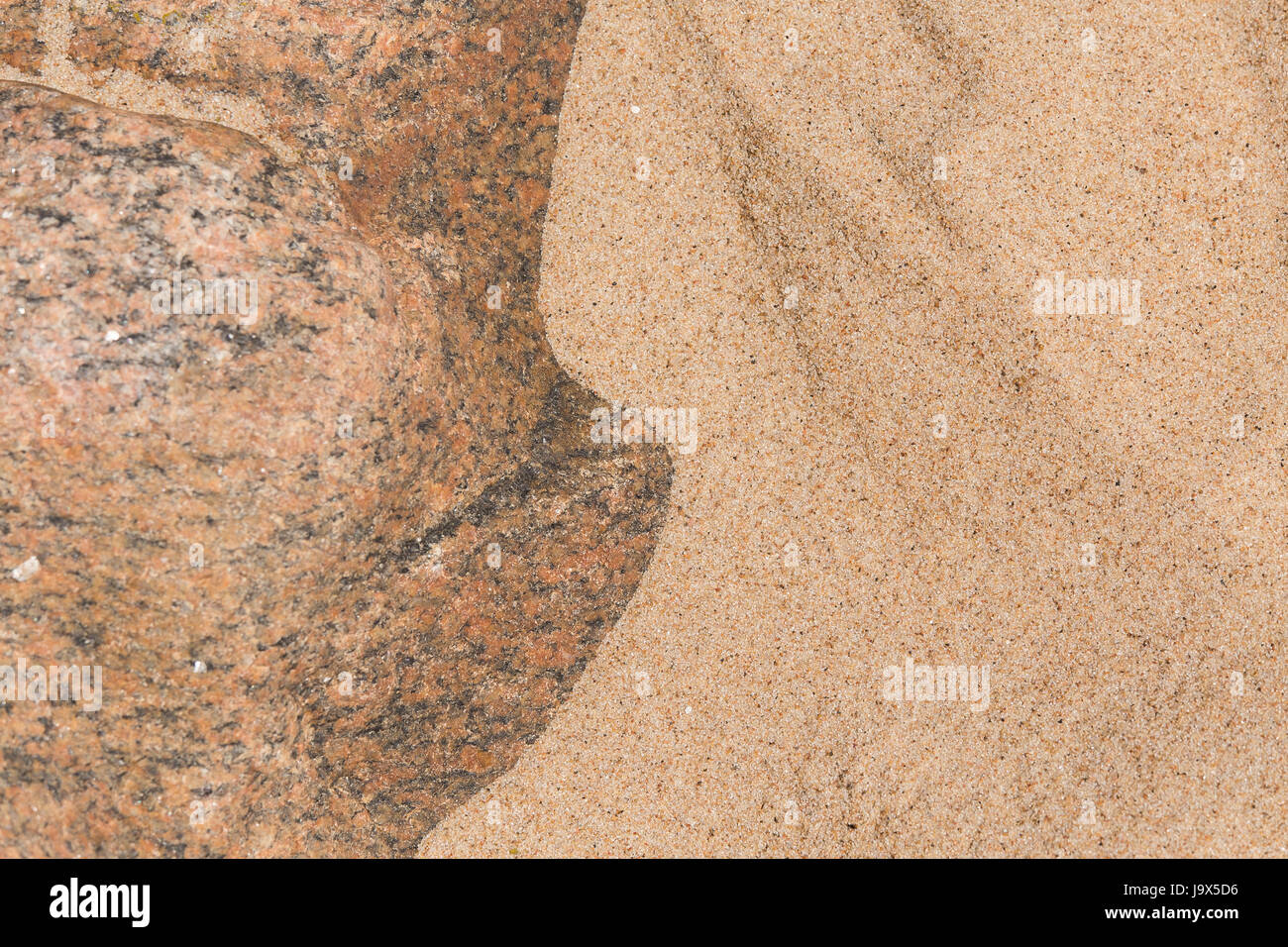 An abstract background of a sea sand and rock shapes. Shallow depth of ...