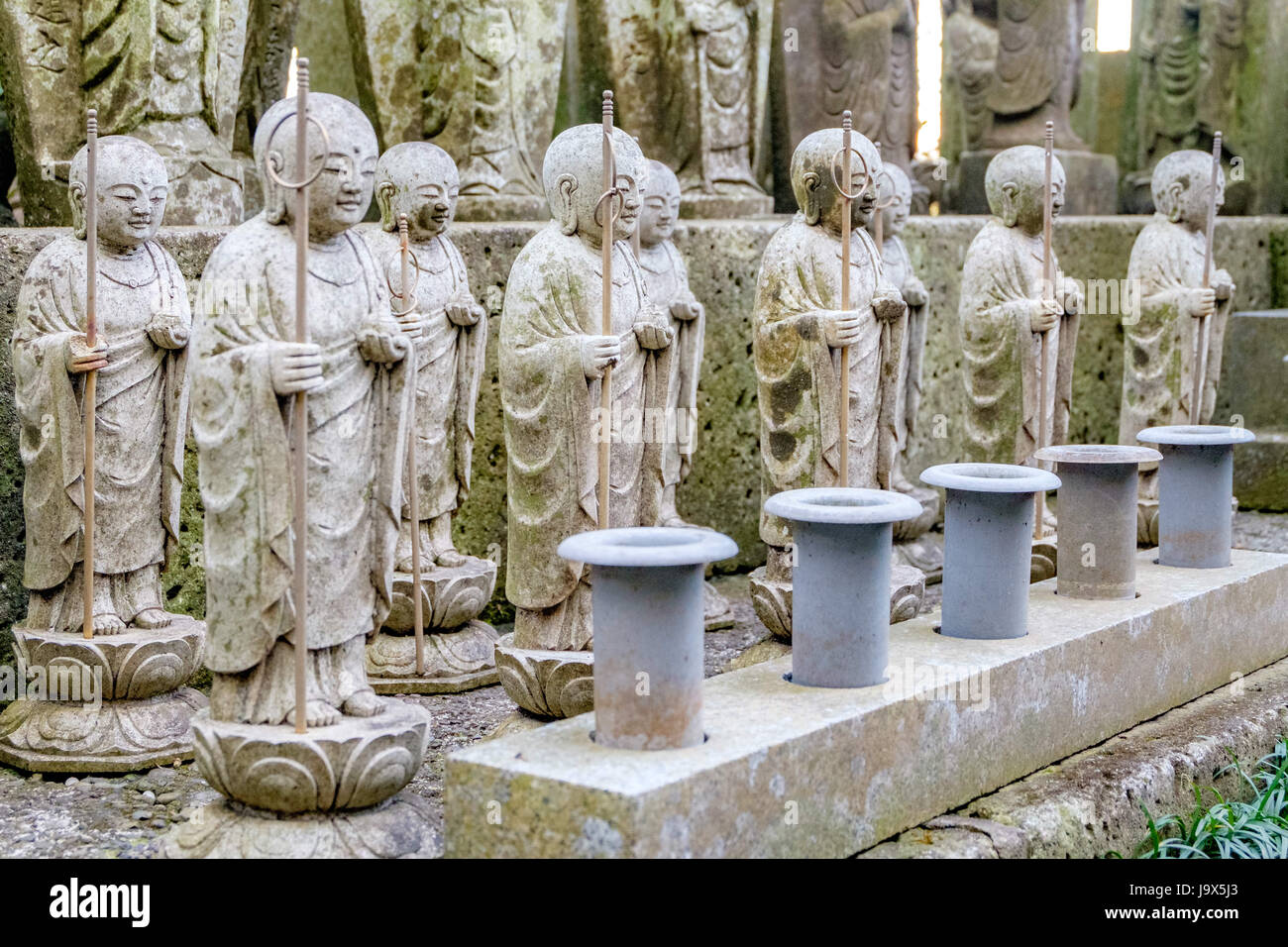 Llittle monk statue in temple Stock Photo - Alamy