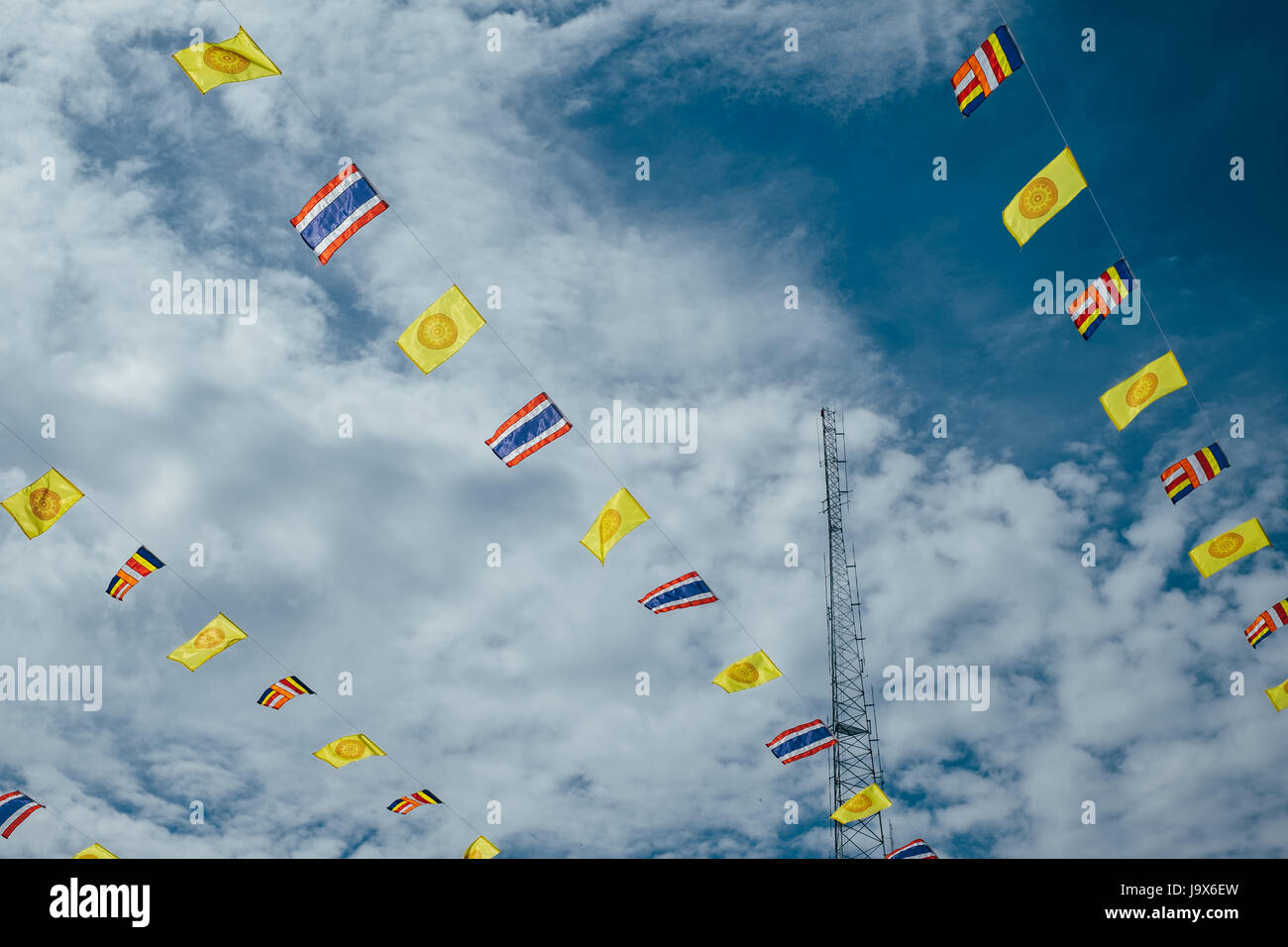 Thai flag strings with cloud blue sky Stock Photo - Alamy