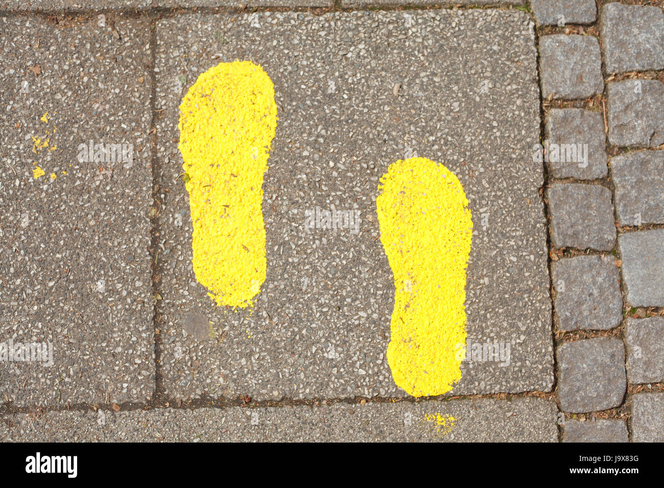Yellow Street Mark Footprints Stock Photo - Alamy
