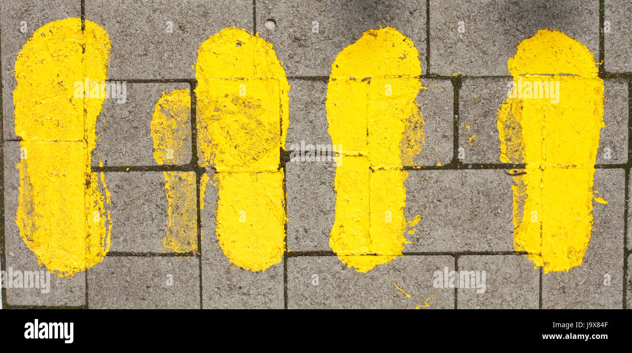 Yellow Street Mark Footprints Stock Photo - Alamy