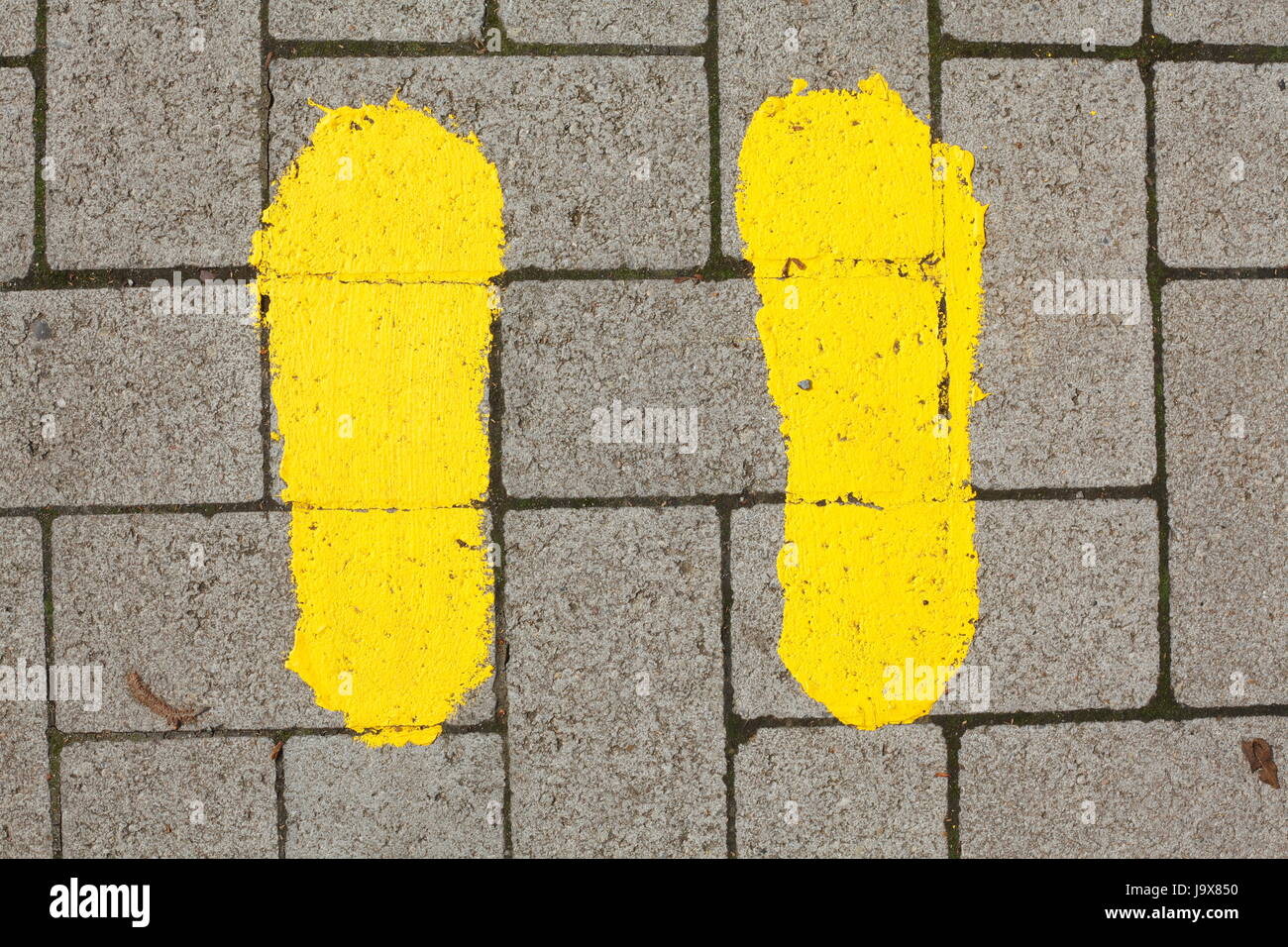 Yellow Street Mark Footprints Stock Photo - Alamy