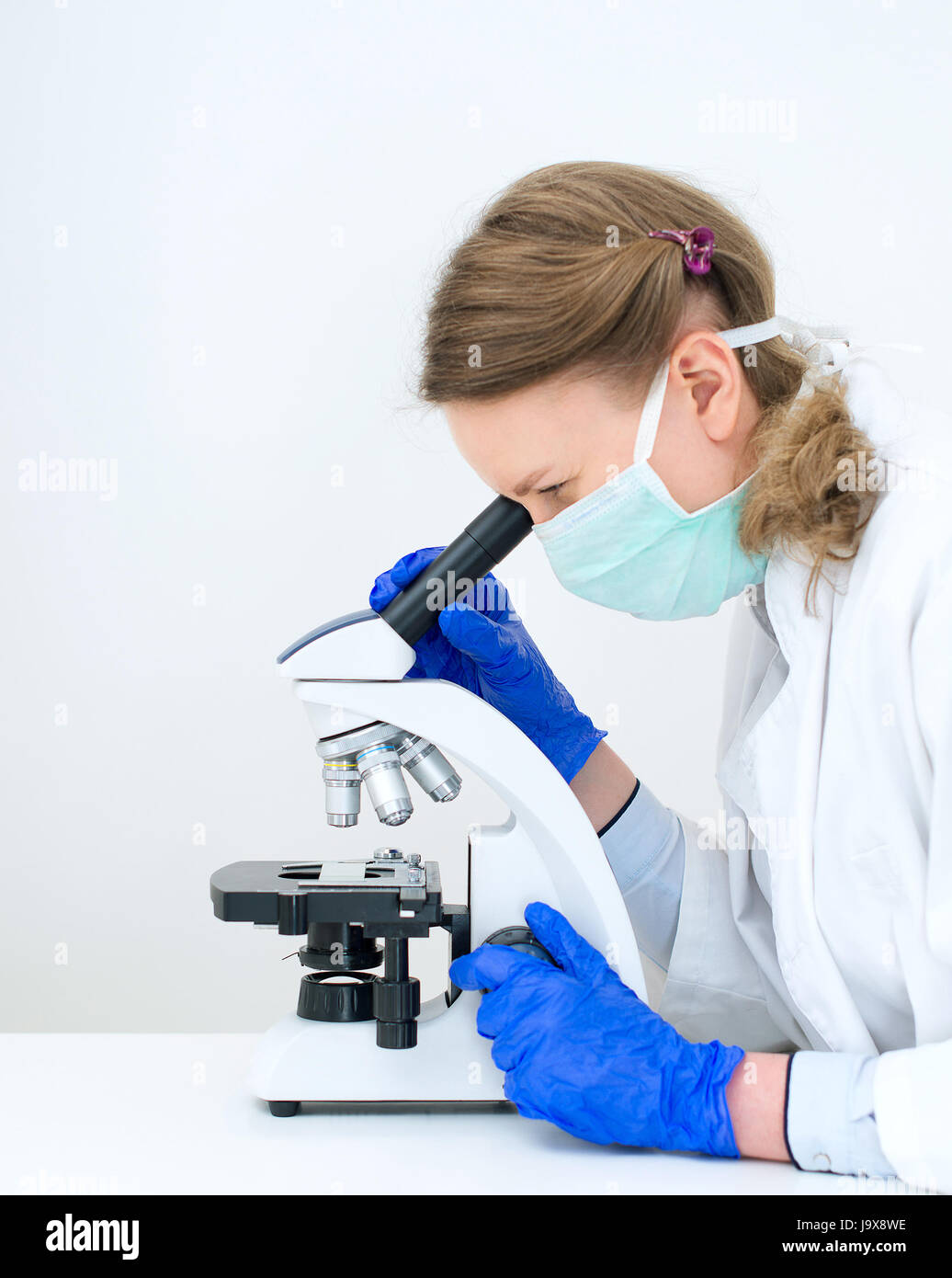 Doctor using microscope in laboratory. Space for text Stock Photo - Alamy