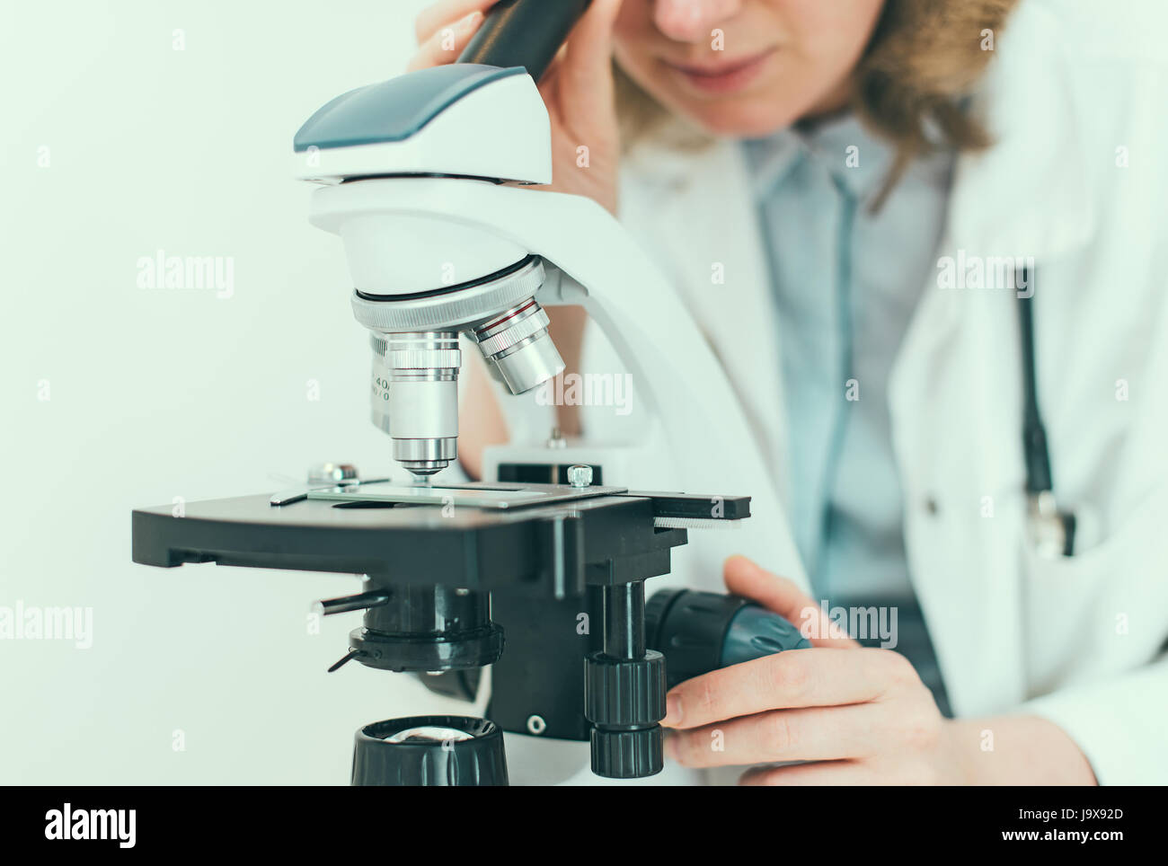 Scientist using microscope in laboratory Stock Photo - Alamy