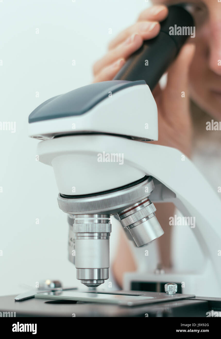 Scientist using microscope in laboratory Stock Photo - Alamy
