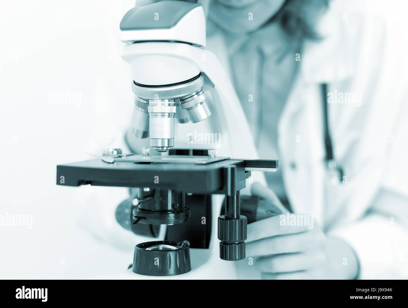 Scientist using microscope in laboratory Stock Photo - Alamy