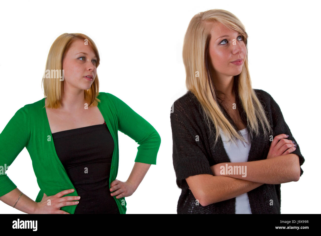 Two woman friends have an argue with each other- isolated on white ...