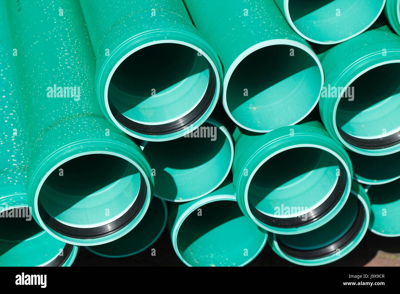 green plastic pipes Stock Photo - Alamy
