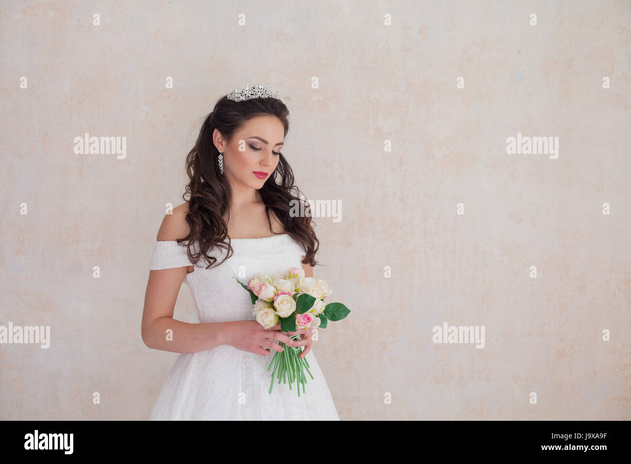 bride Princess stands in a wedding dress with flowers Stock Photo - Alamy