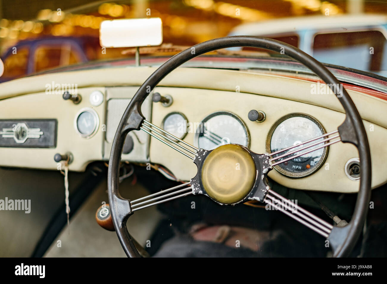 Old vintage console front steering wheel Stock Photo - Alamy