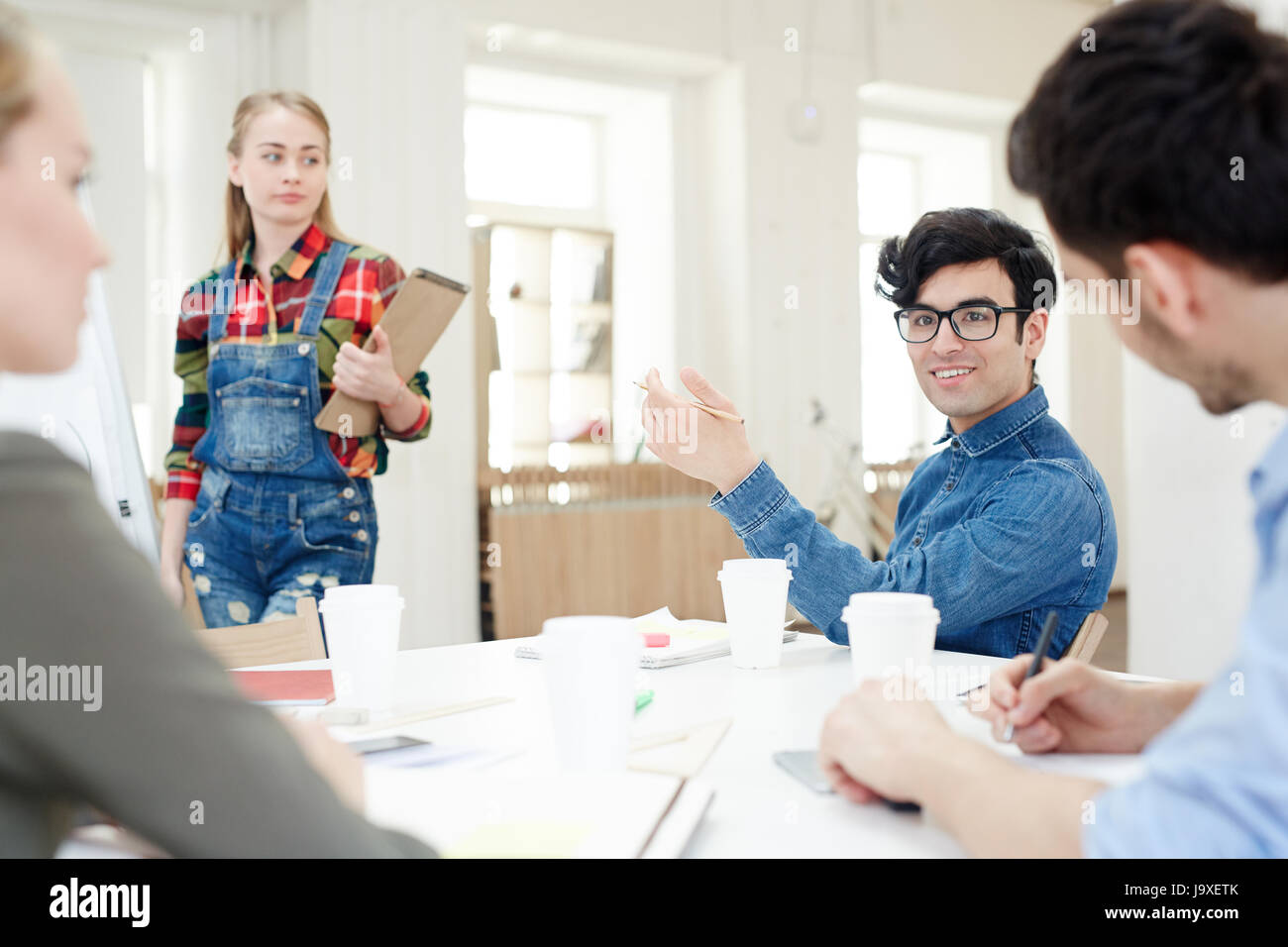Group of learners brainstorming during discussion Stock Photo - Alamy