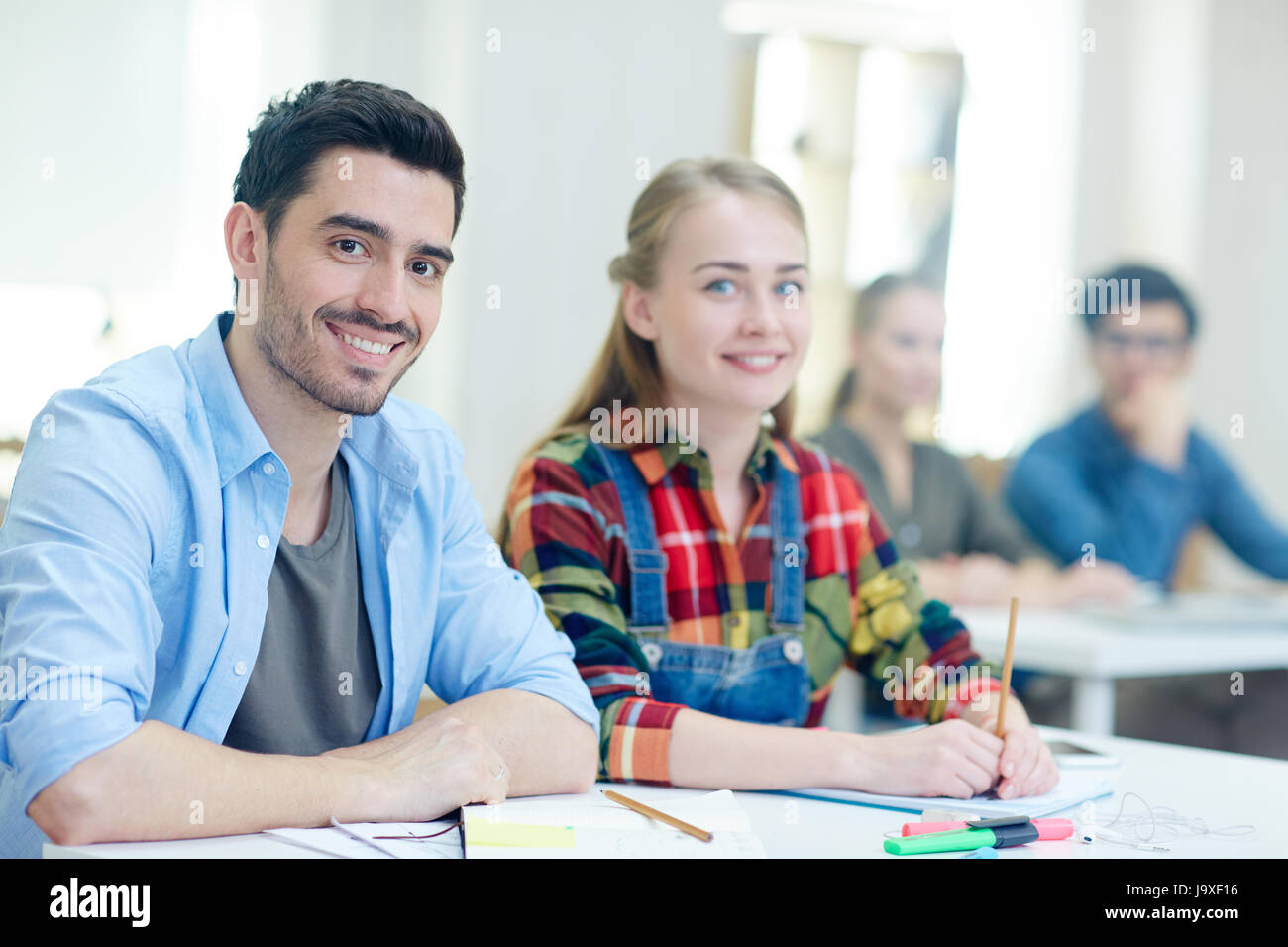 University students looking at camera during lecture Stock Photo - Alamy