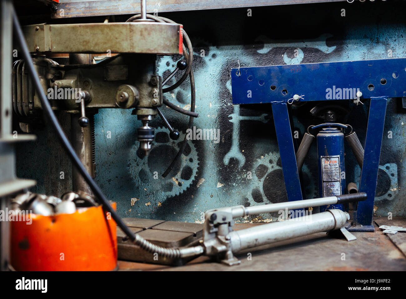 Background image of various equipment on floor in mechanics workshop ...