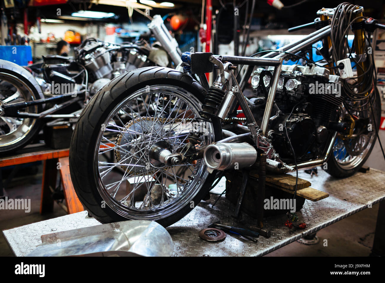 Background image of big disassembled motorcycle in workshop, ready for ...