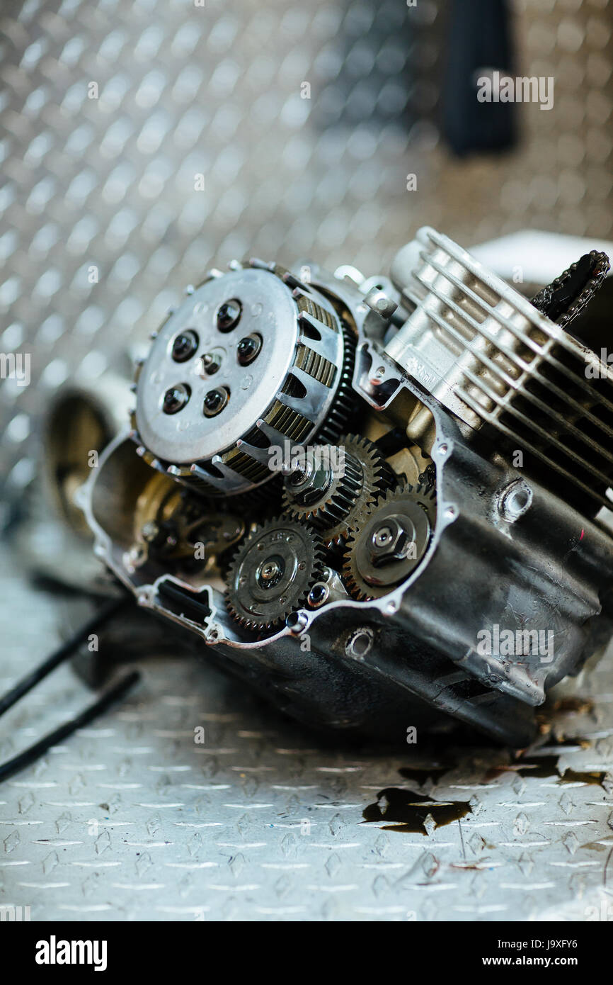 Closeup image of metal car part on table in mechanics workshop Stock ...