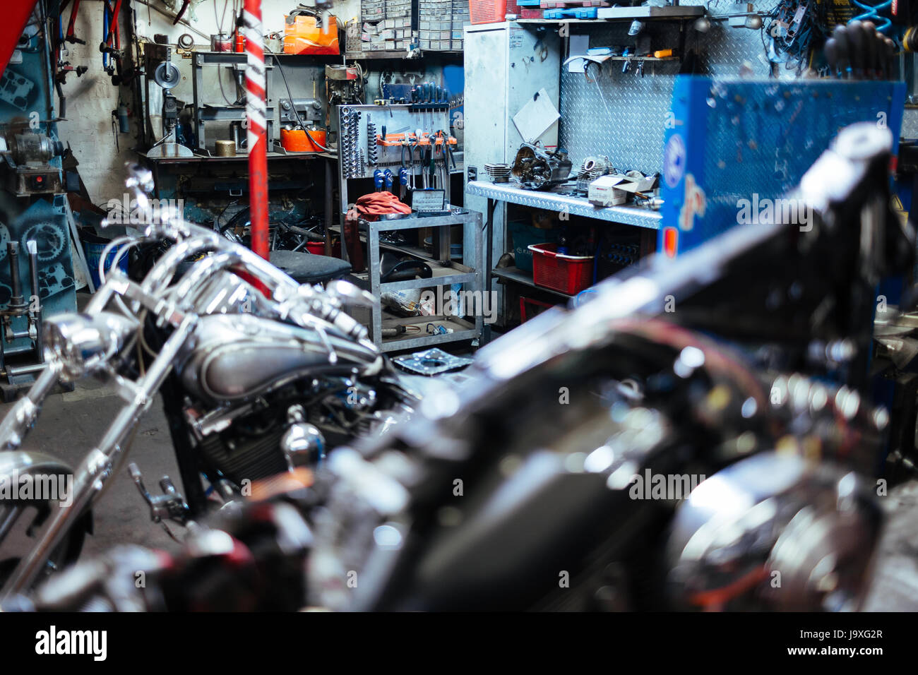 Background image on empty mechanics workshop with motorcycles waiting ...