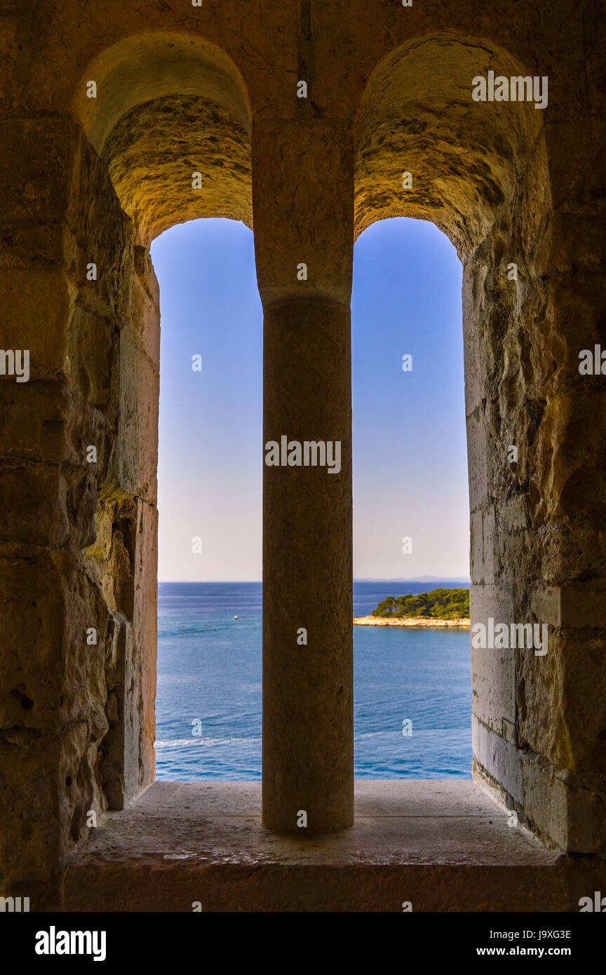 Stone arch window with a beautiful Adriatic sea view, the island of Rab ...
