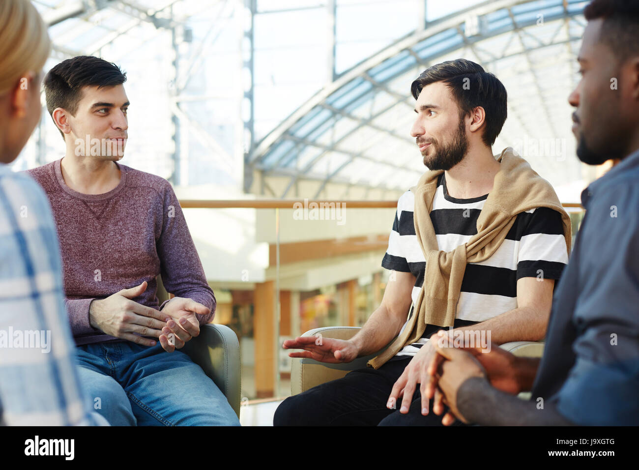 Young managers having discussion of ideas Stock Photo - Alamy