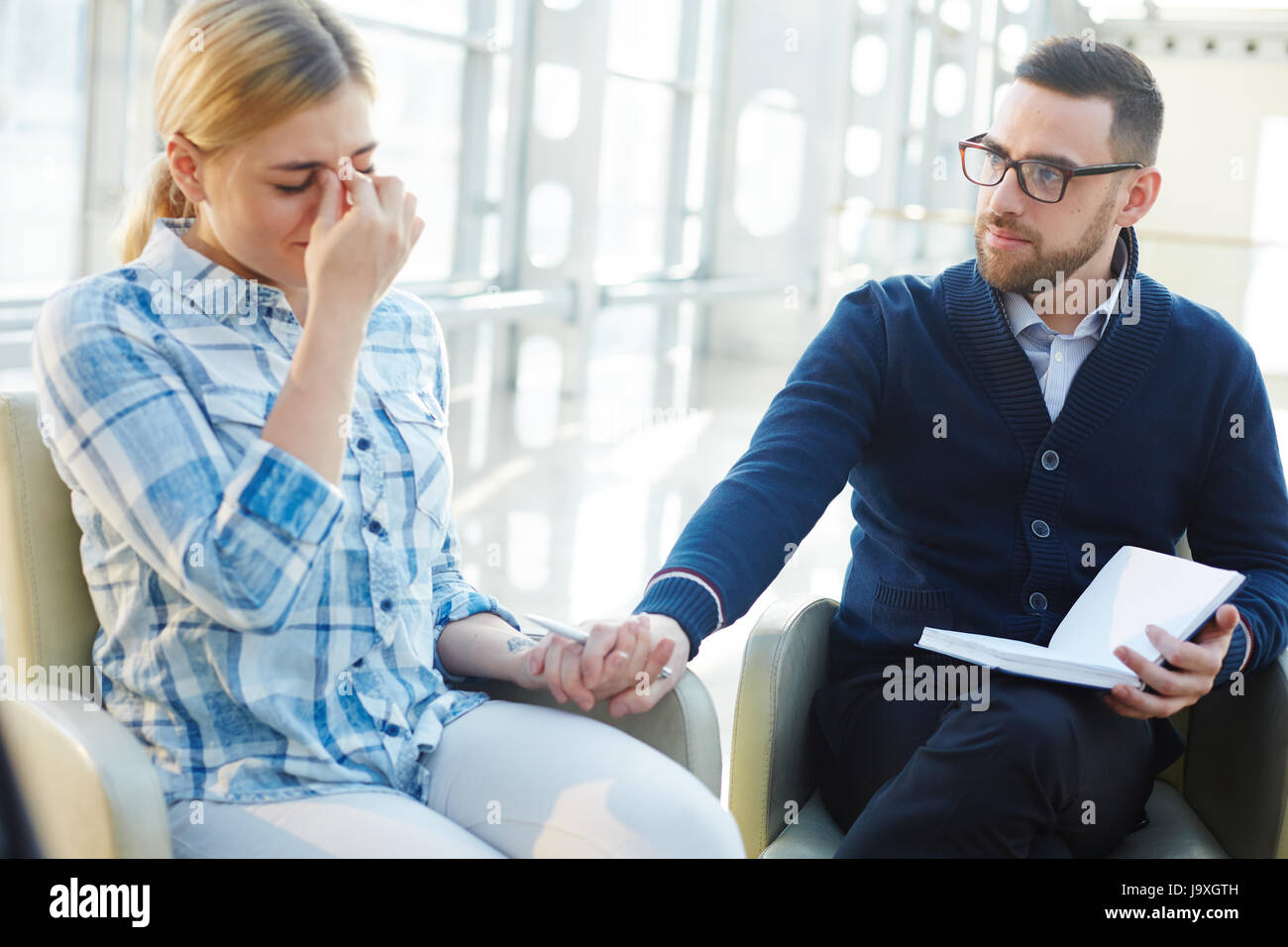 Businessman comforting his worried colleague Stock Photo - Alamy