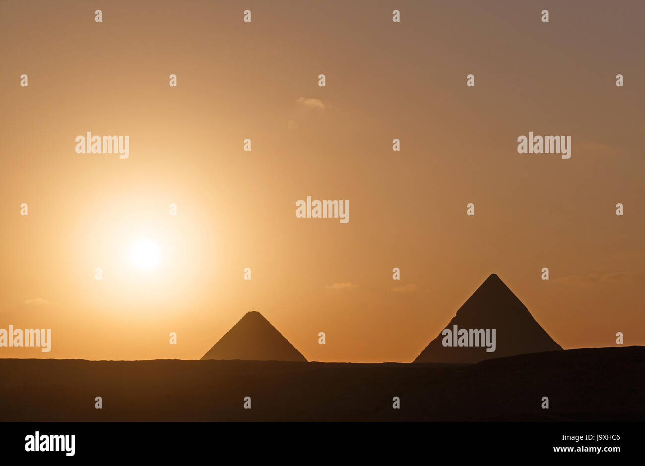 landscape with two pyramids at sunrise Stock Photo - Alamy