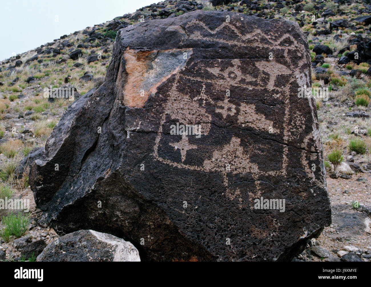 Pueblo carving of an altar with sky & rain-related symbols including ...