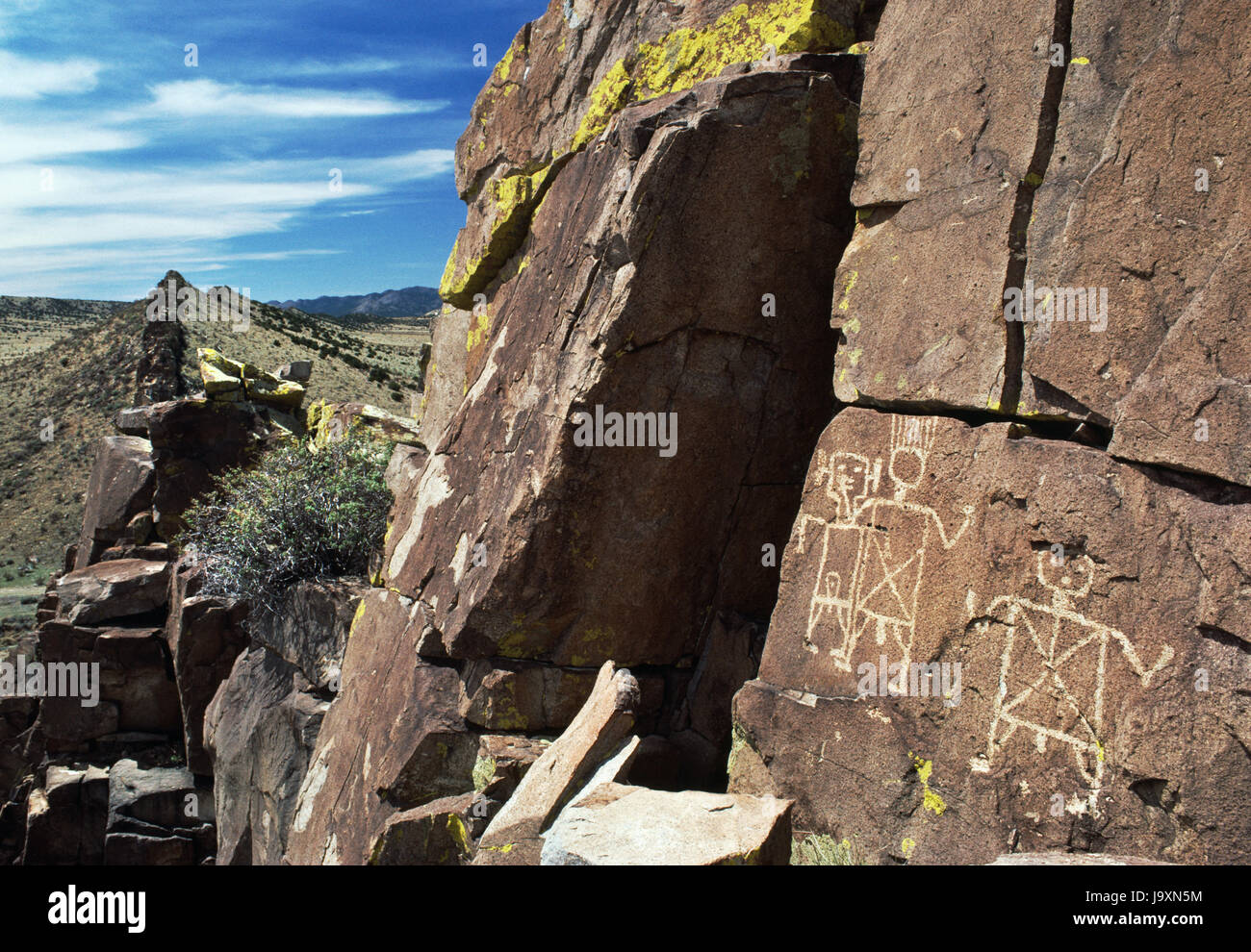 Pueblo ceremonial figures )kachinas) carved on Comanche Gap volcanic ...